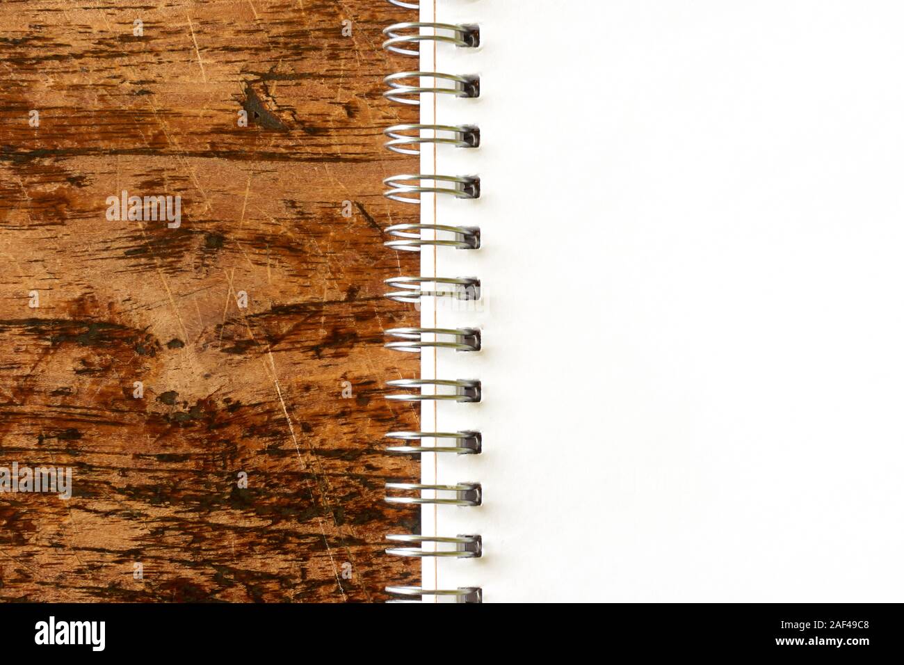 Top view image of blank open notebook page with spiral ring on dark ...