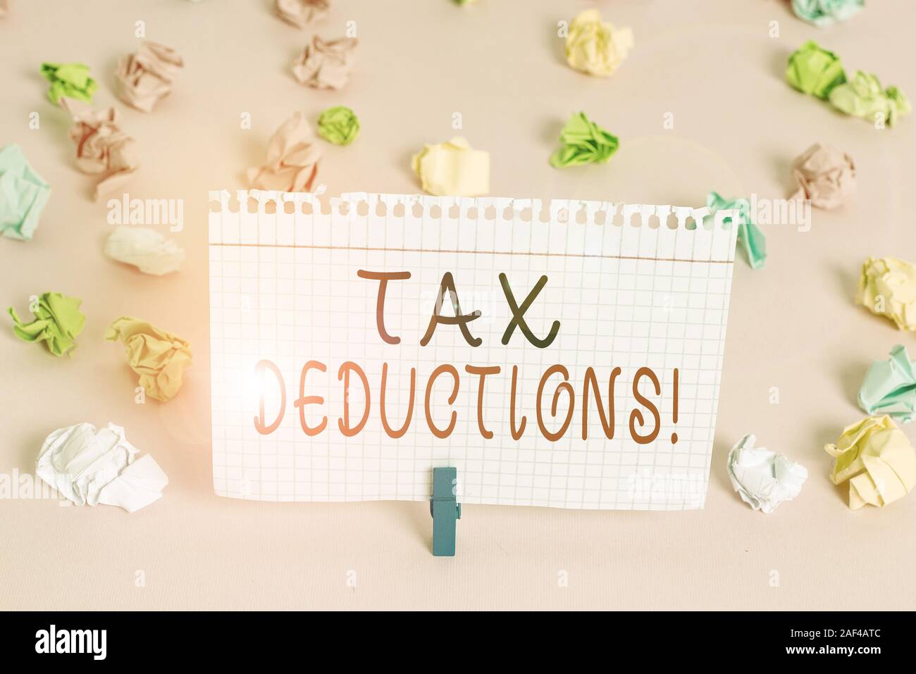 Writing note showing Tax Deductions. Business concept for reduction ...