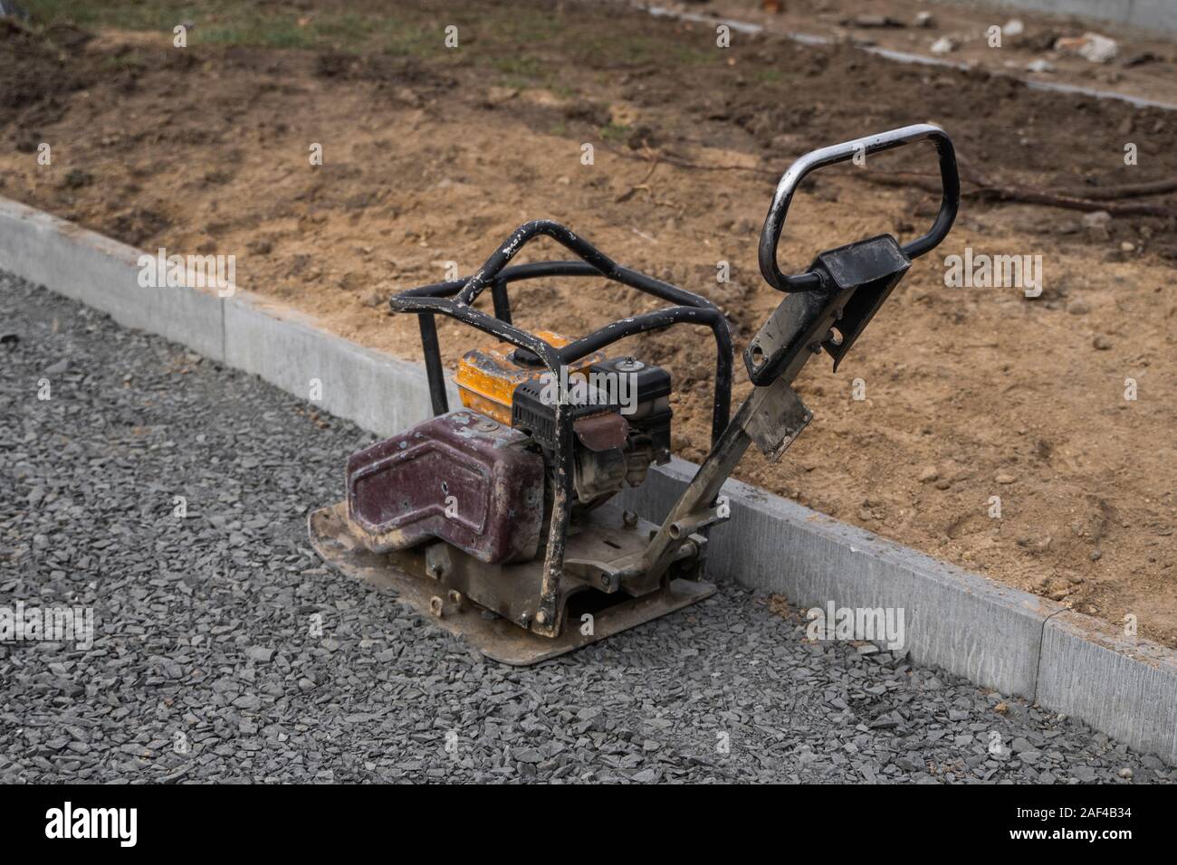 Vibrational paving stone machine for finish on a sidewalk road ...