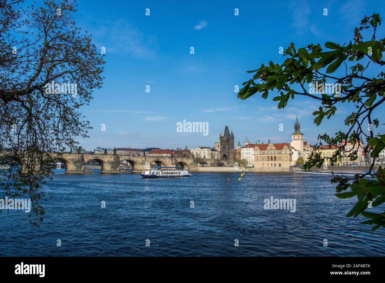 Charles Bridge is a historic bridge that crosses the Vltava river in ...