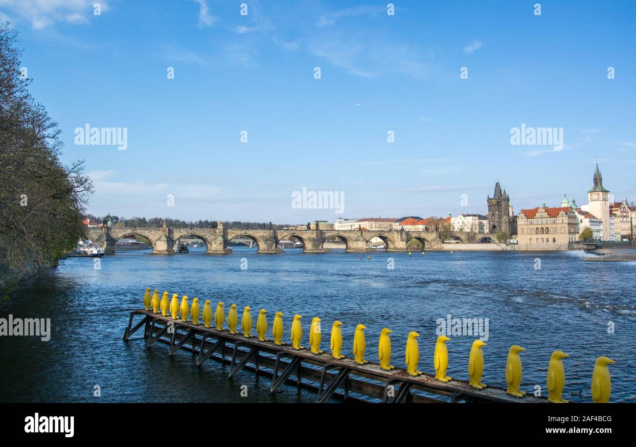 Charles Bridge is a historic bridge that crosses the Vltava river in ...