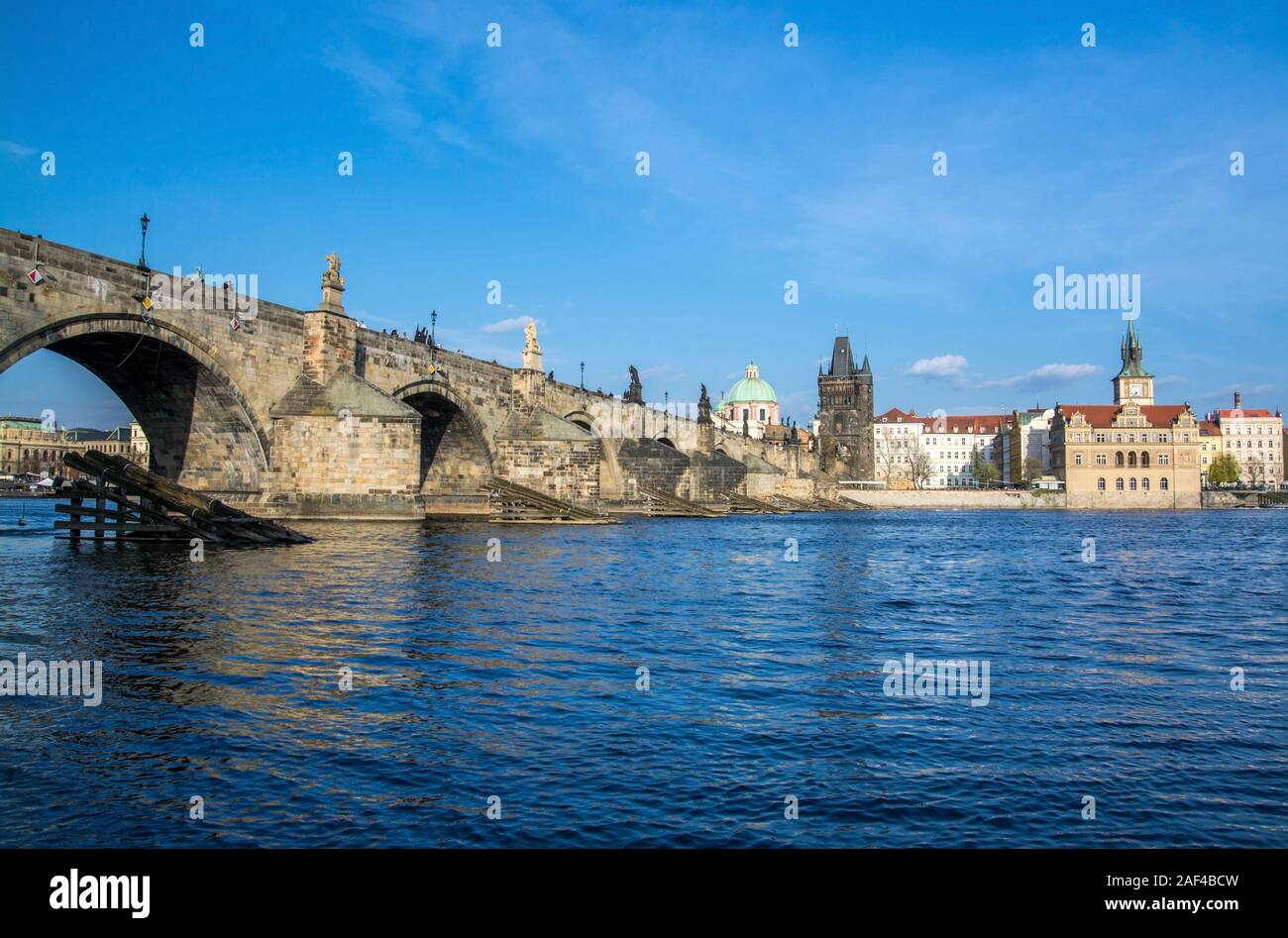 Charles Bridge is a historic bridge that crosses the Vltava river in ...
