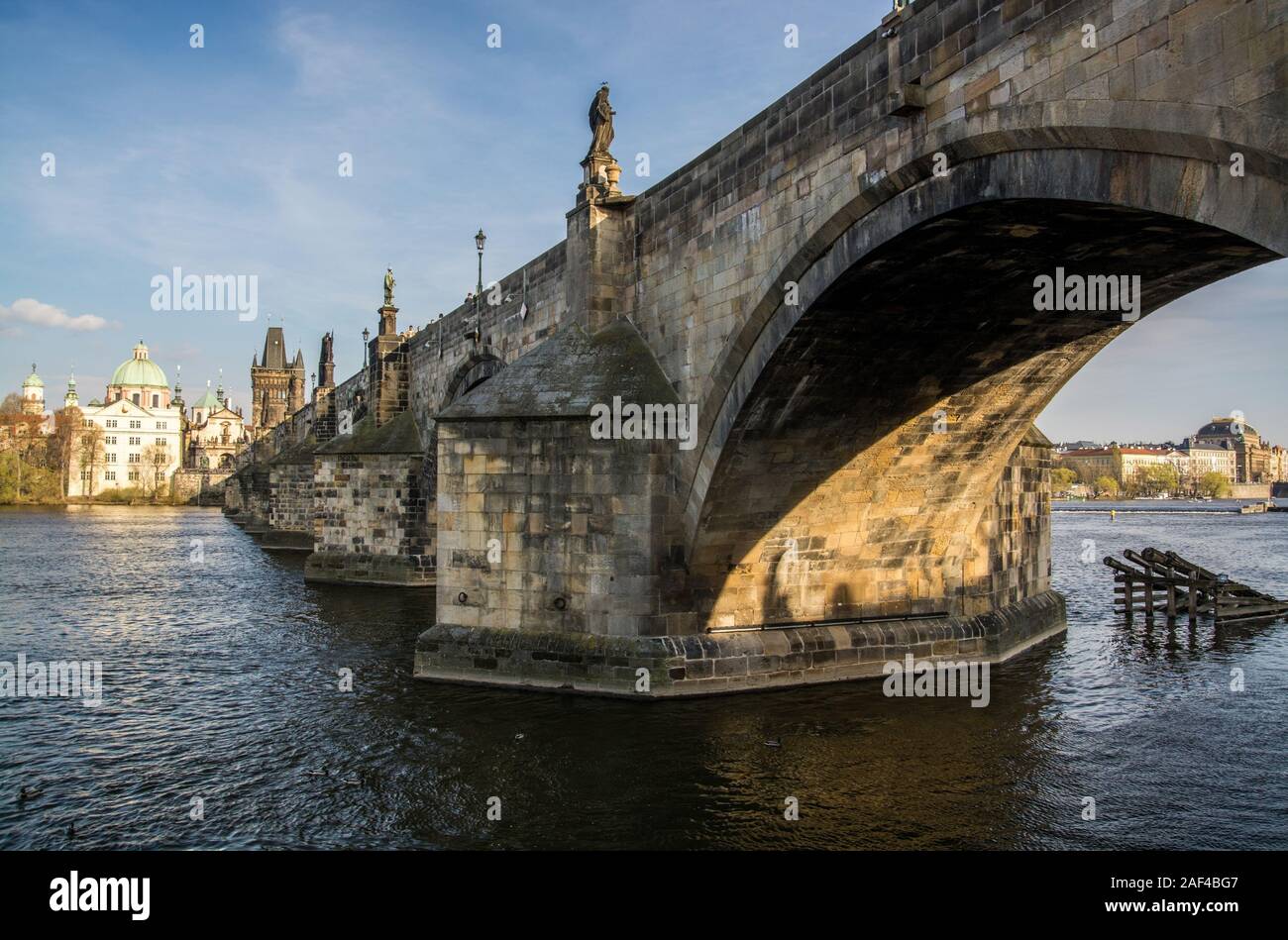 Charles Bridge is a historic bridge that crosses the Vltava river in ...