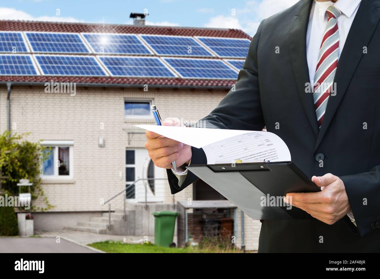Worker checking roof construction hi-res stock photography and images ...