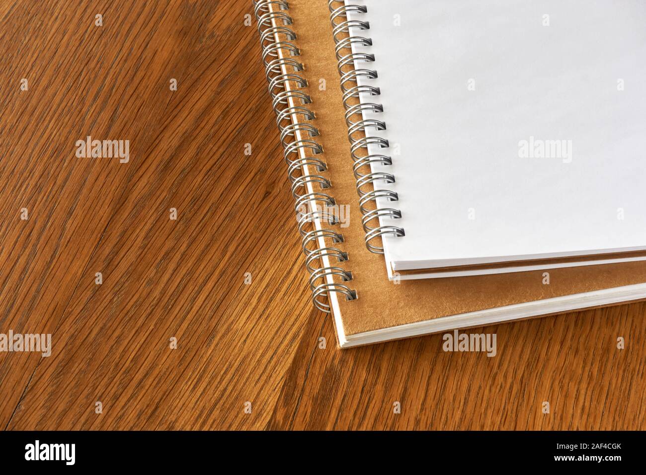 Top view detail of blank open notebook page with spiral ring on dark ...