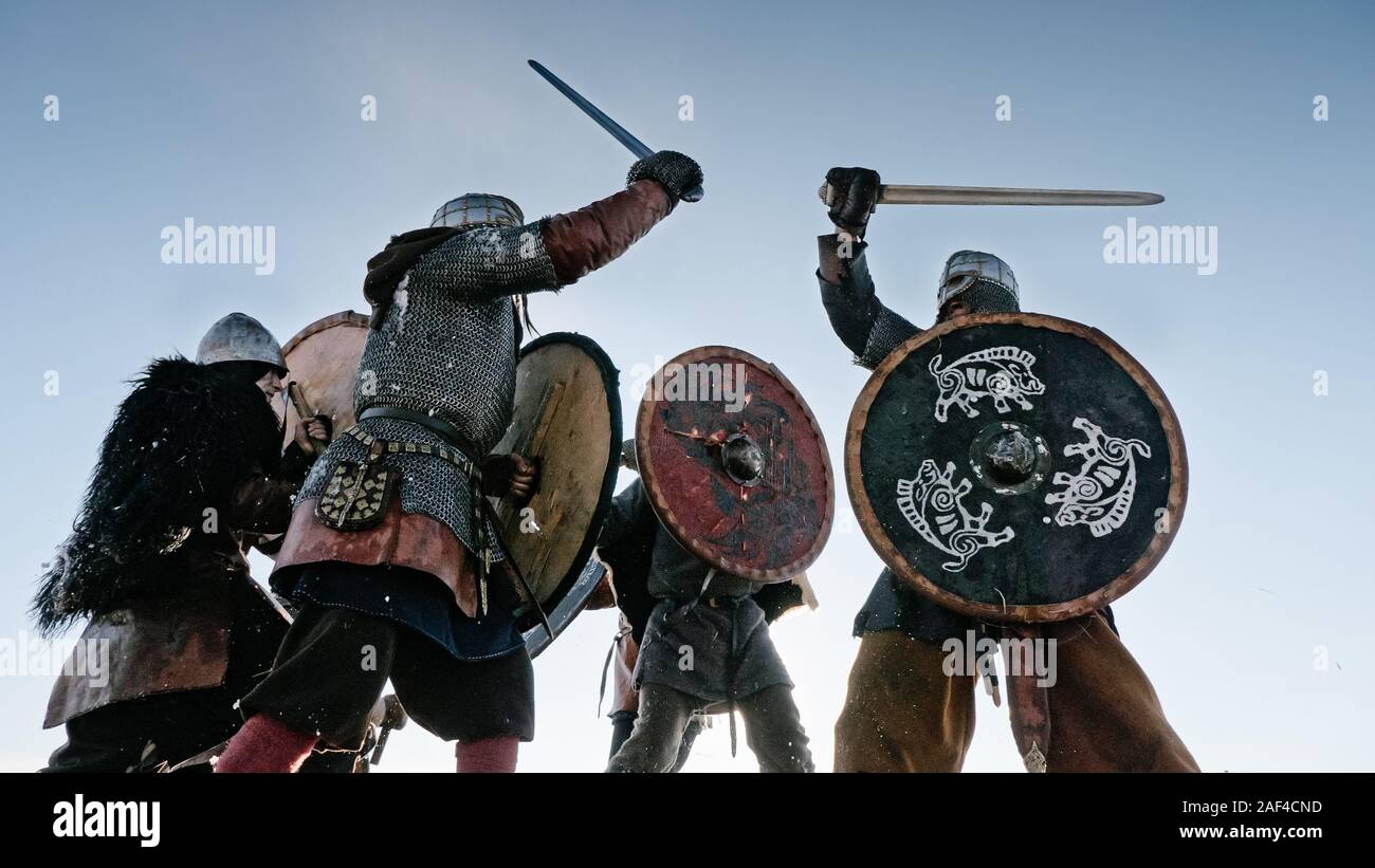 Warriors of vikings are fighting during attack at winter time Stock ...