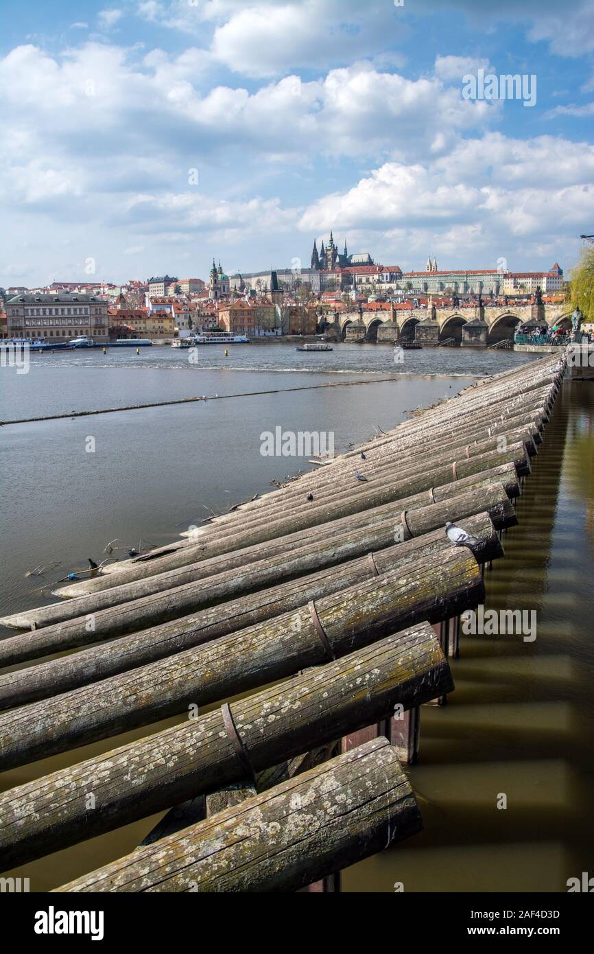 Charles Bridge is a historic bridge that crosses the Vltava river in ...