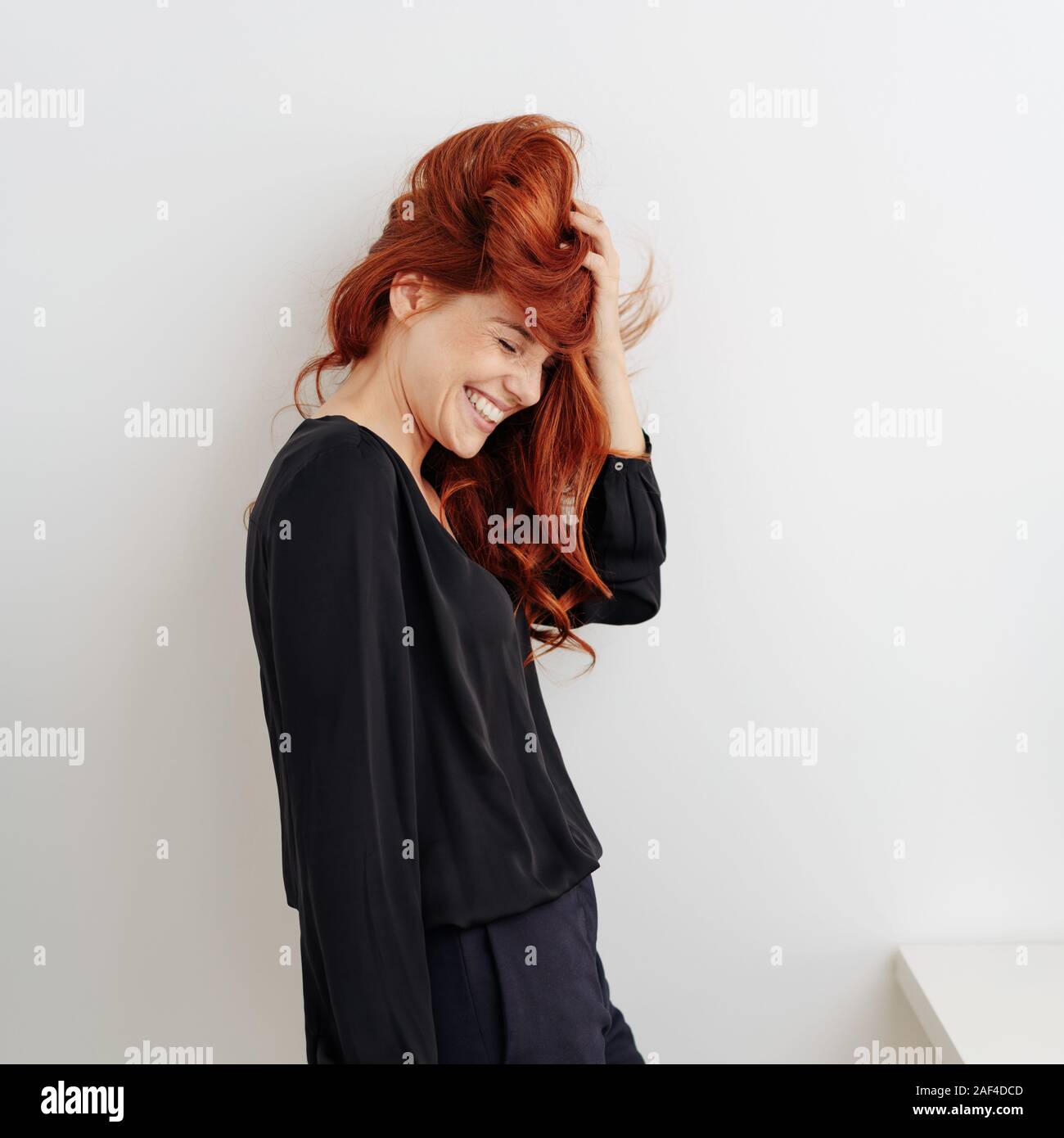 Woman mussing hair hi-res stock photography and images - Alamy
