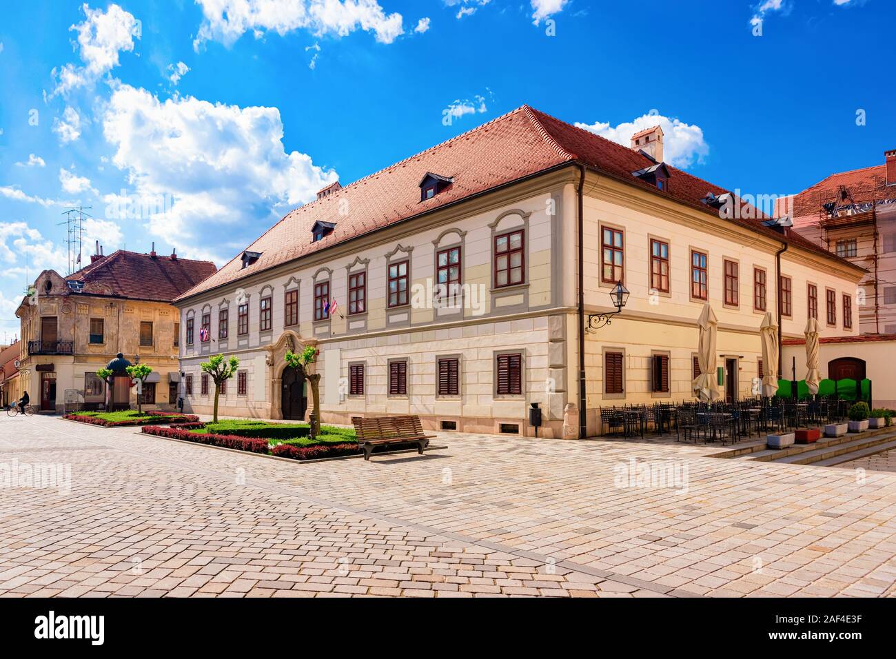 Street with Herzer palace with flags in Varazdin Stock Photo - Alamy