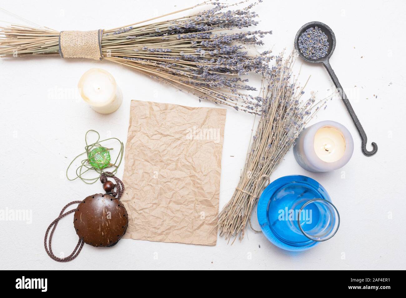 Old magic scroll with copy space and dried lavender flowers on mage ...