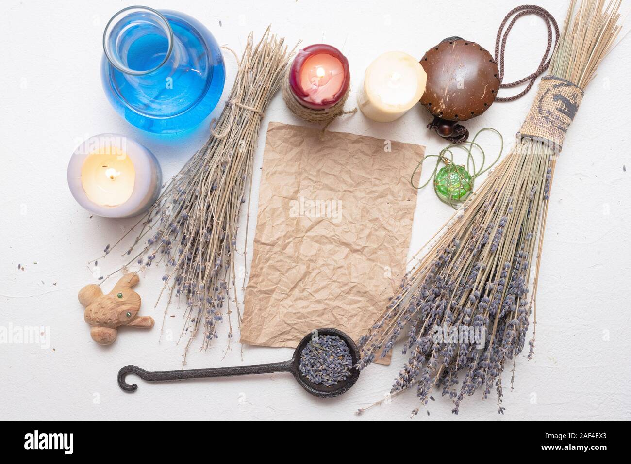 Old magic scroll with copy space and dried lavender flowers on mage ...