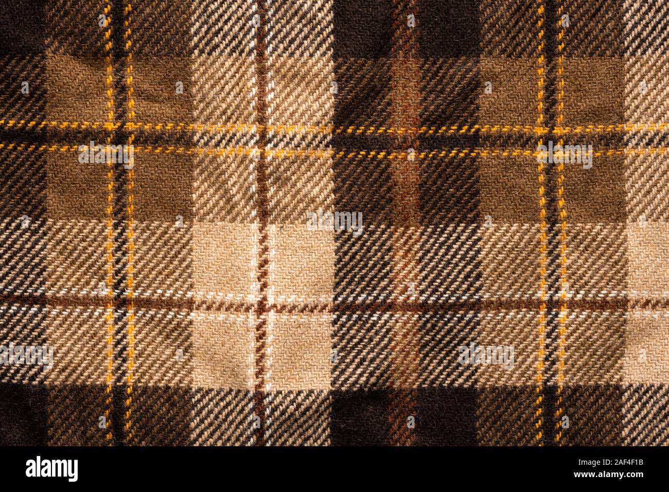 Brown checked fabric. Scottish wool. Fabric for coat plaid suit. Close ...