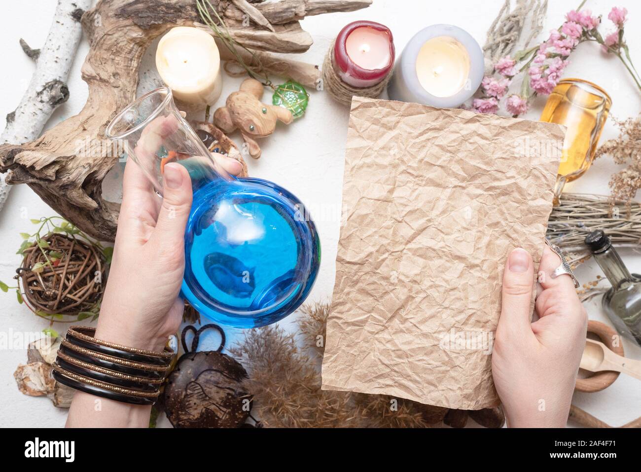 Witch doctor is reading an ancient magic scroll with copy space and ...