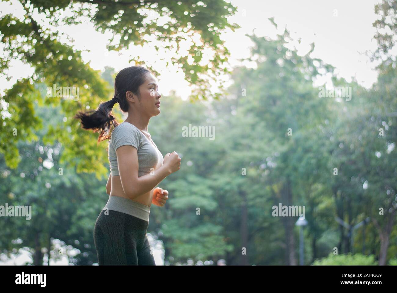 Woman doing running hi-res stock photography and images - Alamy