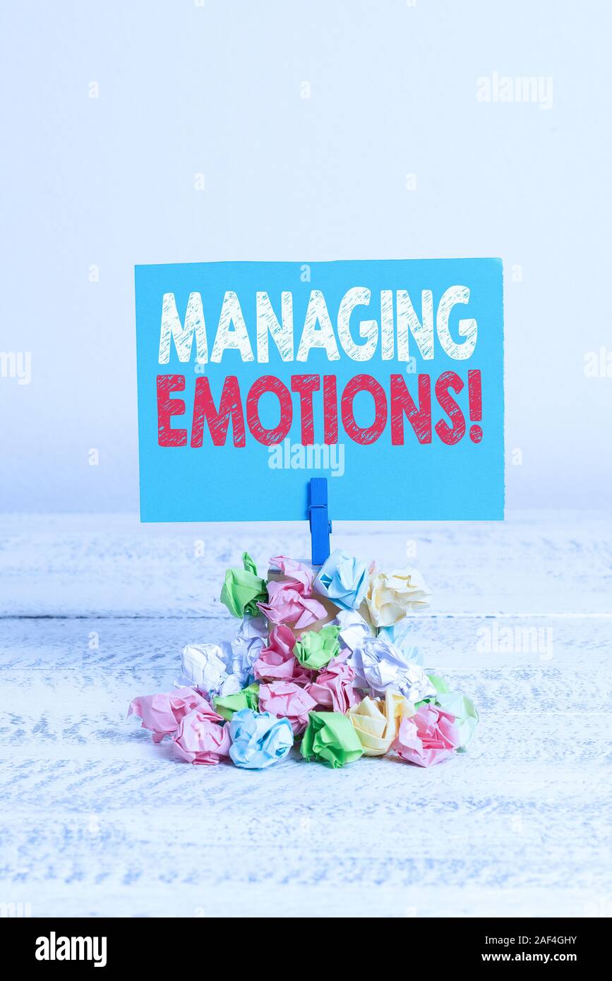 Writing note showing Managing Emotions. Business concept for ability be ...