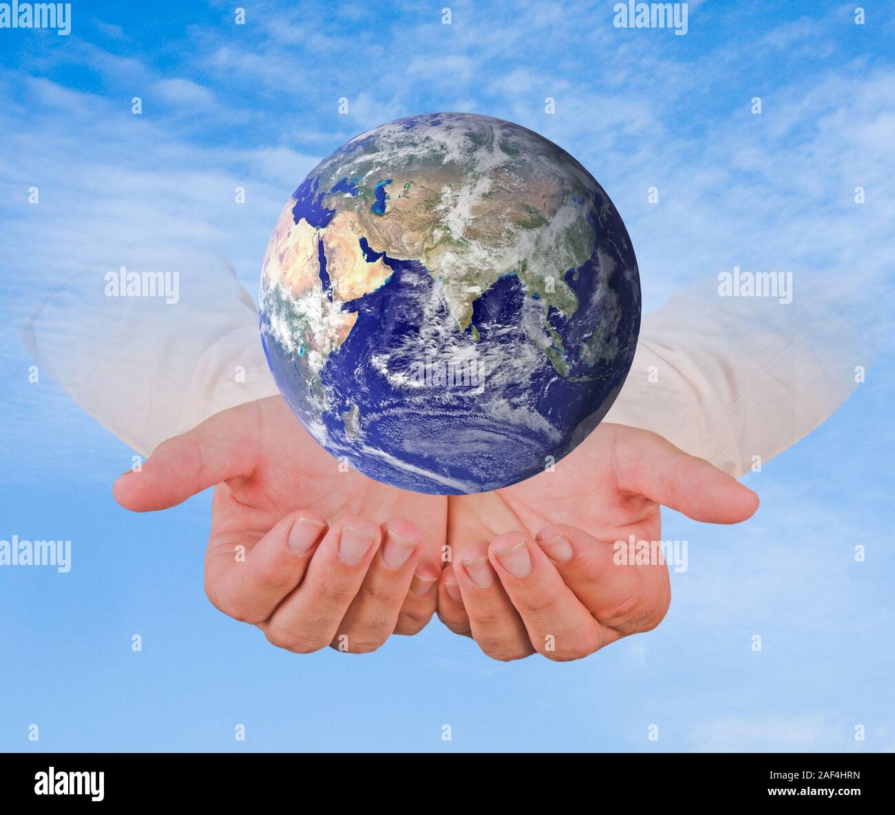 Hands with planet earth Stock Photo - Alamy