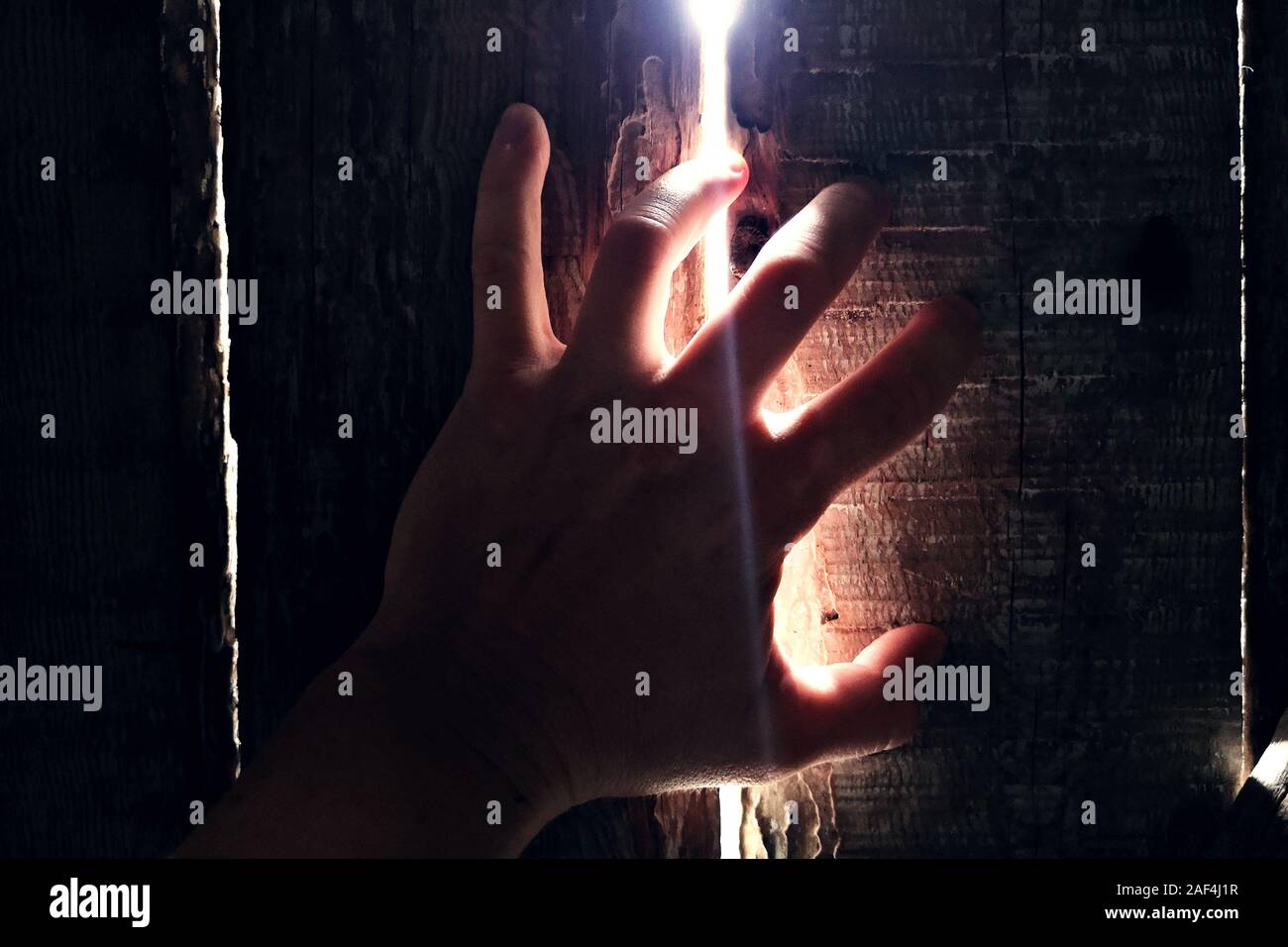 Hand of a man locked in a dark room. Abduction Stock Photo - Alamy