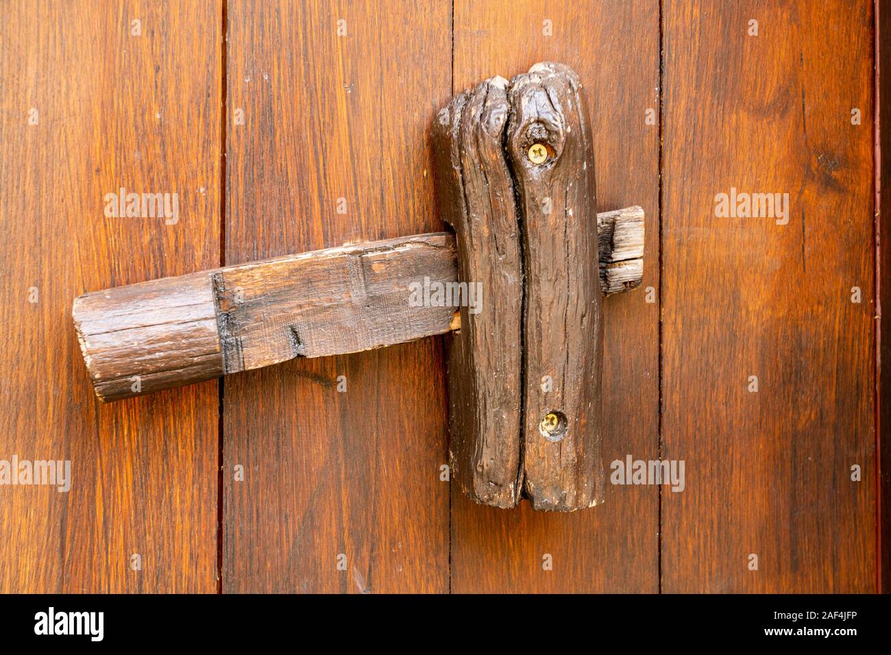 Traditional door lock made of timber in the old schist village of ...