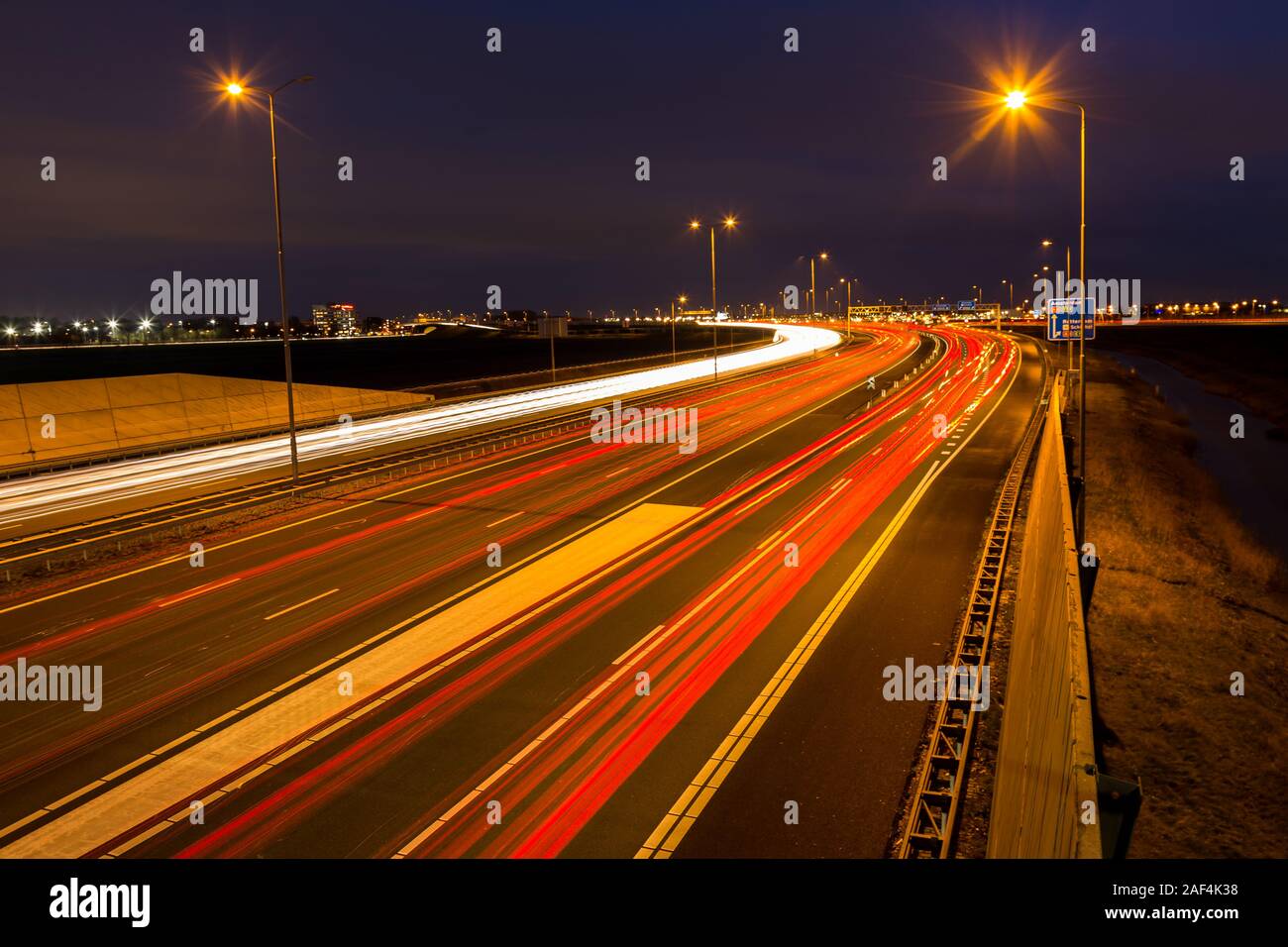 Busy rush hour traffic leaves light trails of red taillights on the A9 ...