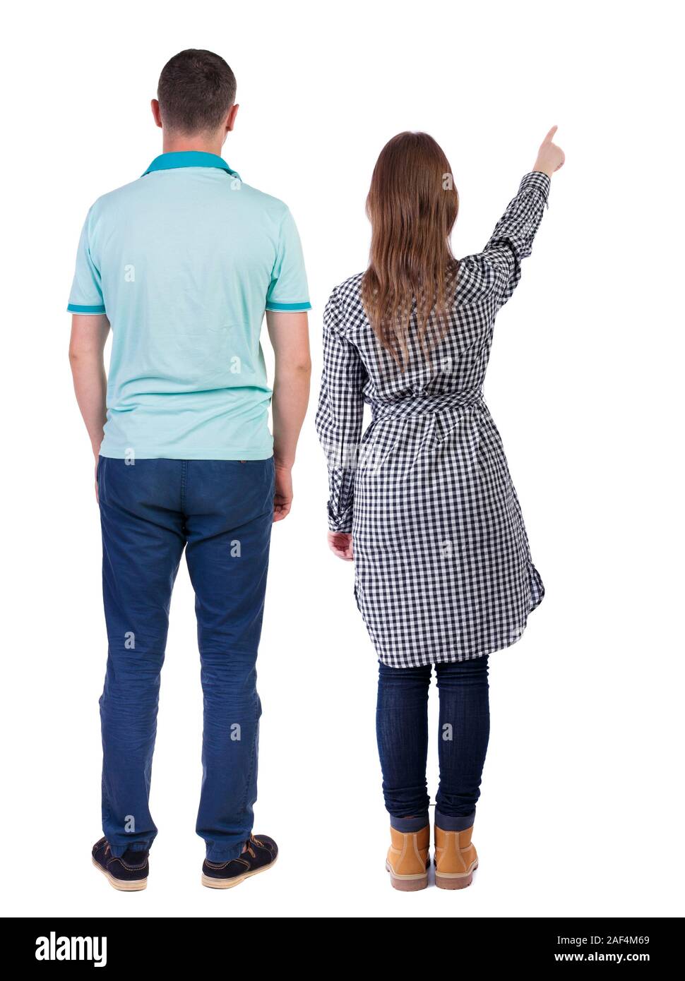 Back view of a stylish couple pointing. beautiful friendly girl and guy ...