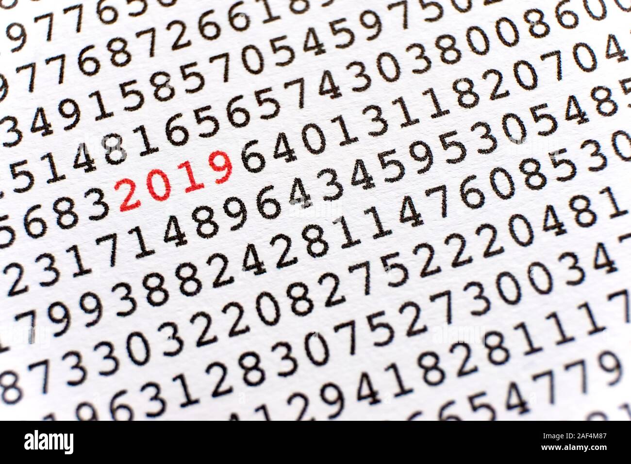 Background with black printed random numbers and the numbers 2019 in ...