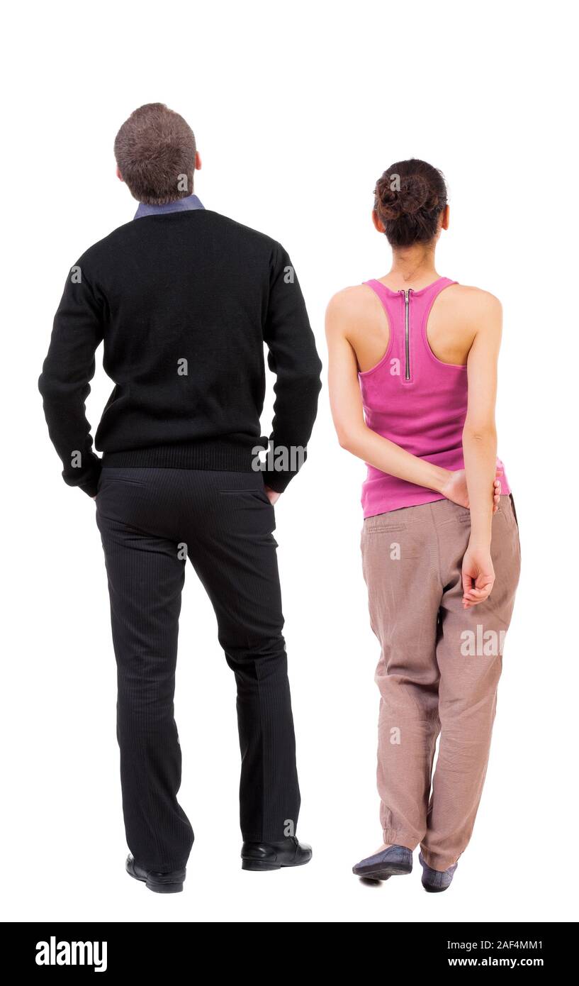 Back view of couple. beautiful friendly girl and guy together. Rear ...