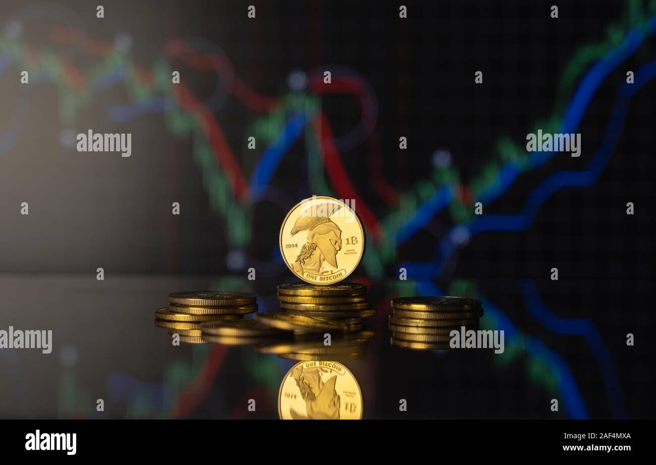 Titan bitcoin and virtual money concept. Gold Titan on a stack of coins ...