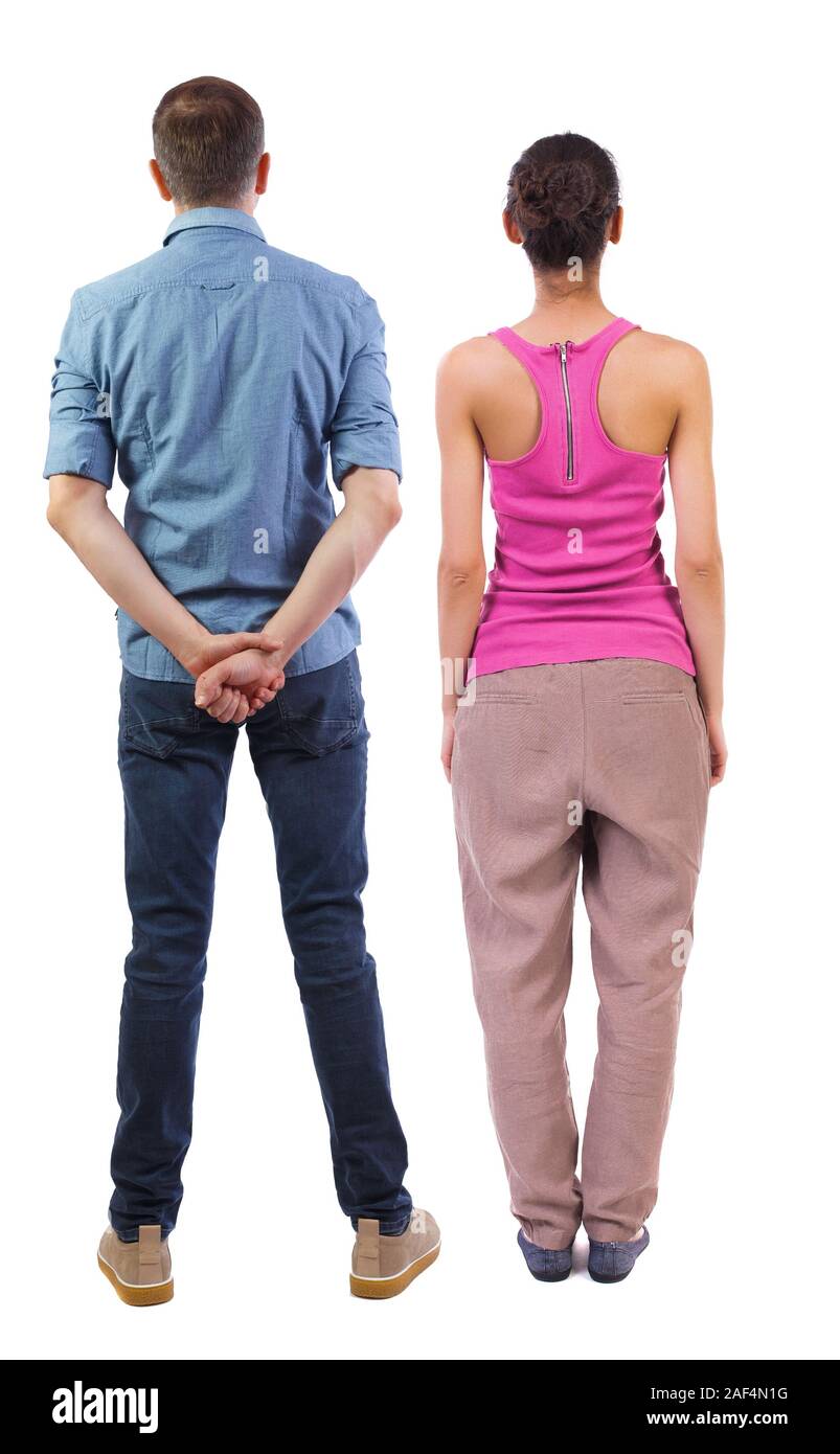 Back view of couple. beautiful friendly girl and guy together. Rear ...