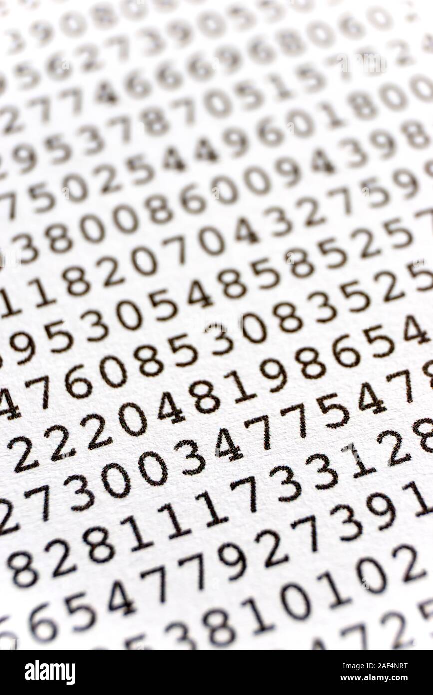 Background with black printed random monospace numbers on white paper ...