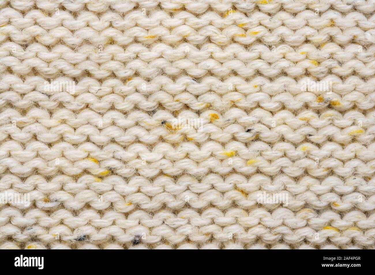 The texture of a knitted sweater. Beige pattern. Inside. Background ...