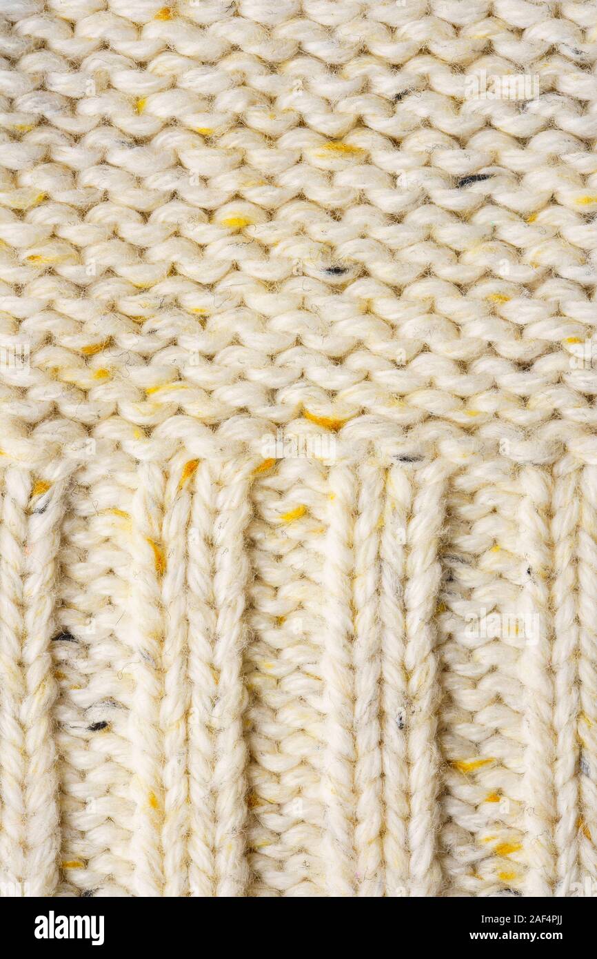 The texture of a knitted sweater. Beige pattern. Inside. Background ...