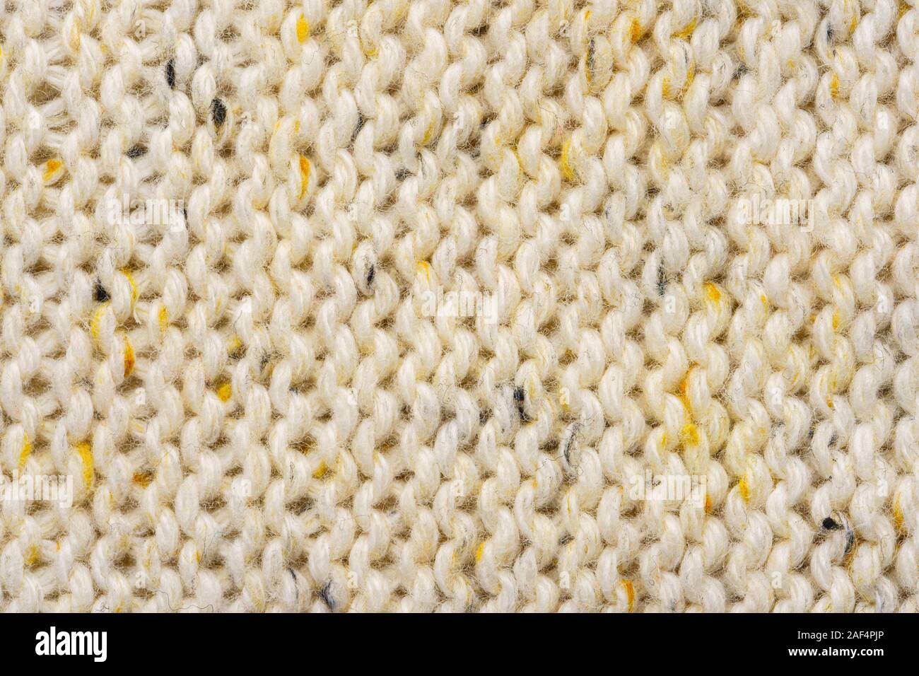 The texture of a knitted sweater. Beige pattern. Inside. Background ...