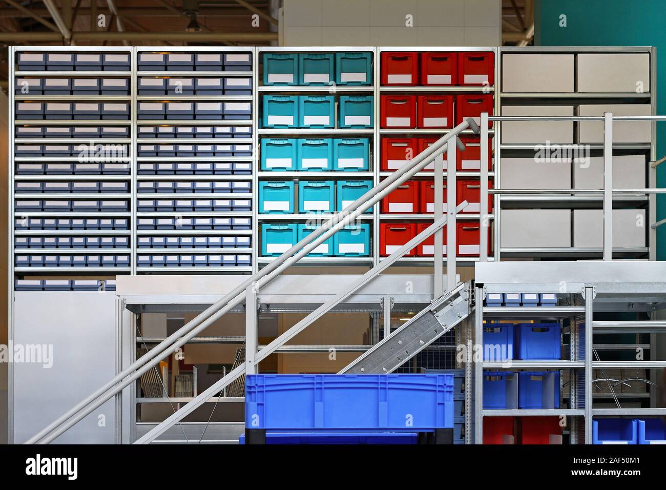 Modern storage room with crates and boxes Stock Photo - Alamy