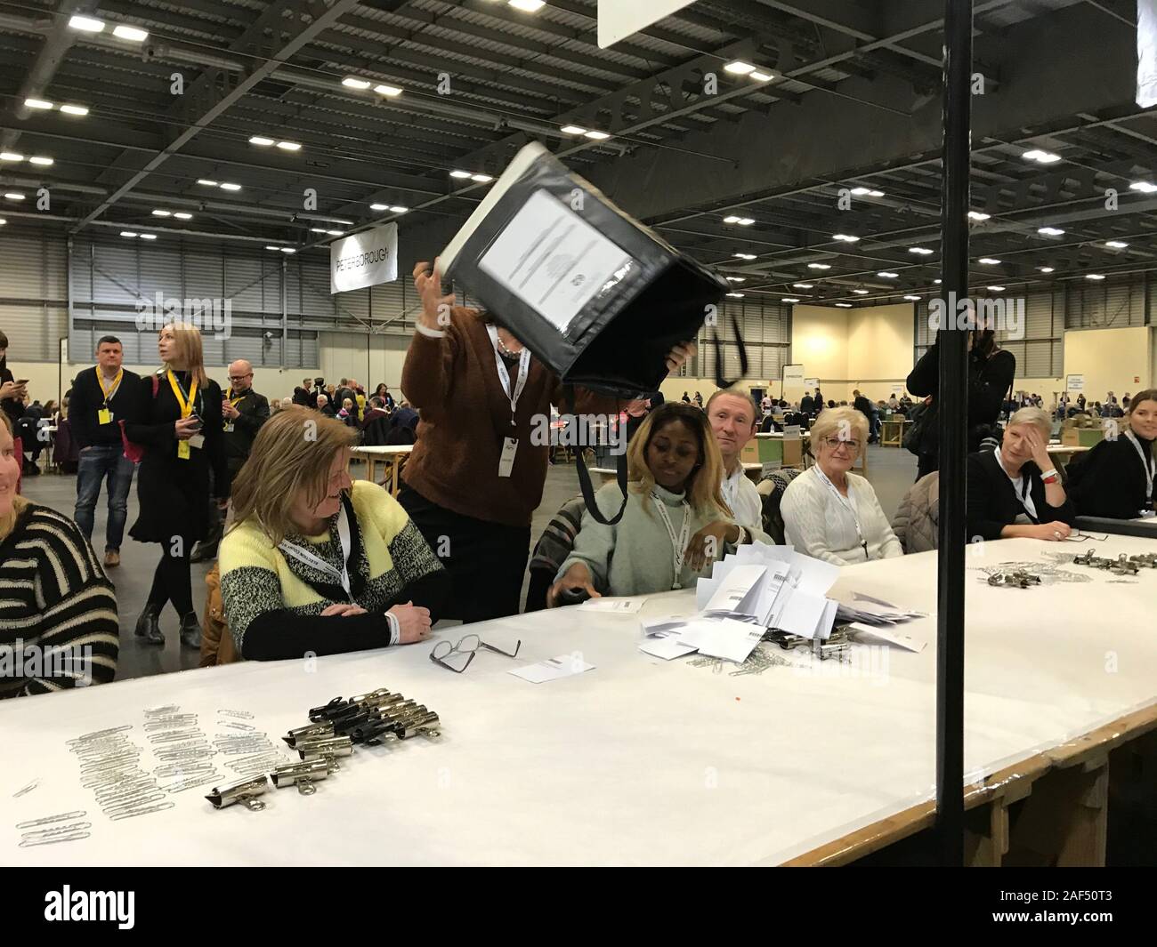 The first ballot box is emptied during the count at Peterborough Arena ...