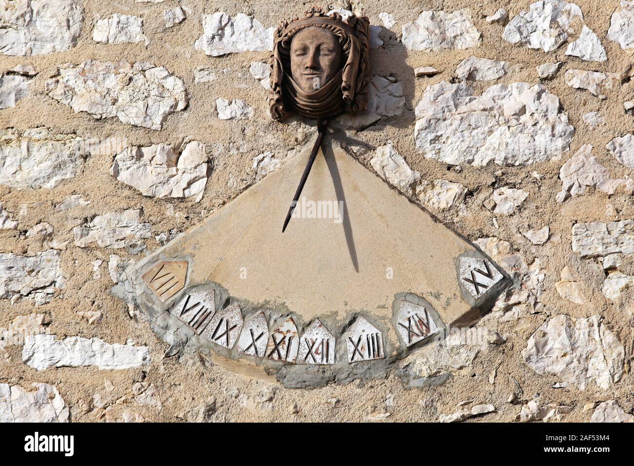 Sundial clock with Roman numbers at south wall Stock Photo - Alamy