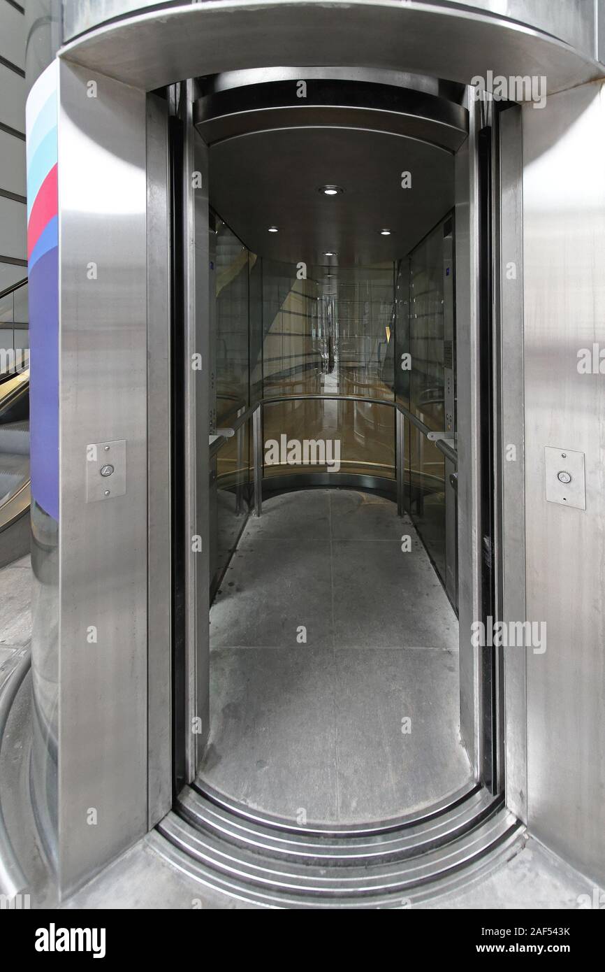 Open slide door at modern glass elevator Stock Photo - Alamy