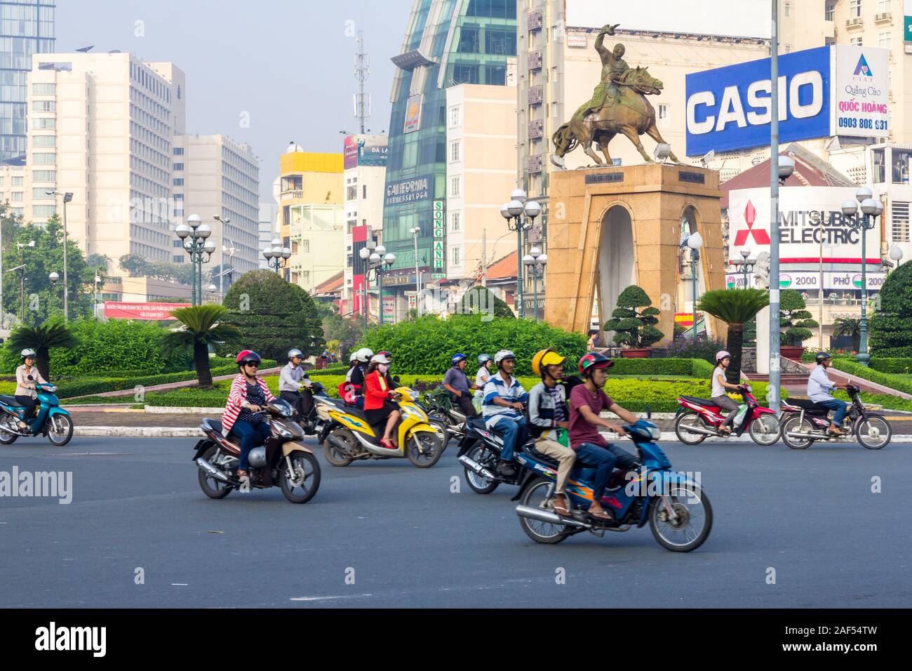 Ho Chi Minh City, Vietnam - November 11th 2013: Motorbikes passing the ...