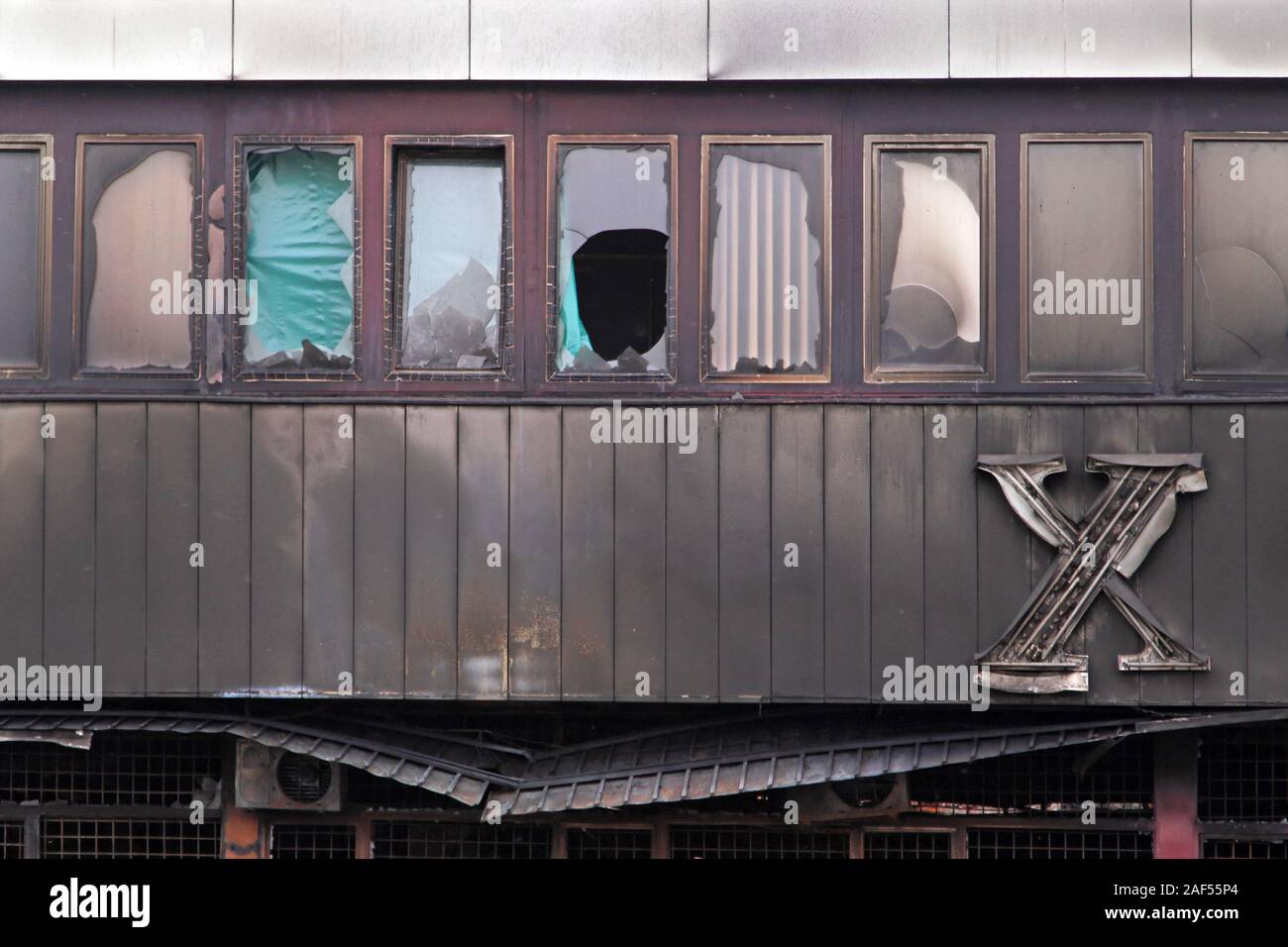 Factory building exterior damaged by fire inferno Stock Photo - Alamy
