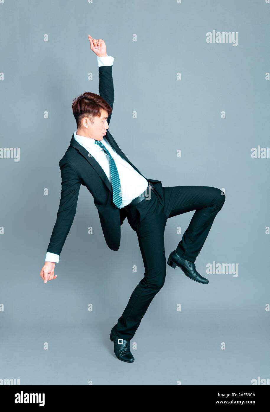 Man dancing in suit hi-res stock photography and images - Alamy