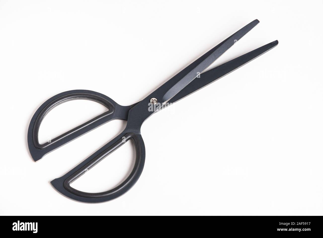 A pair of uniquely designed retro or vintage style scissors in black ...
