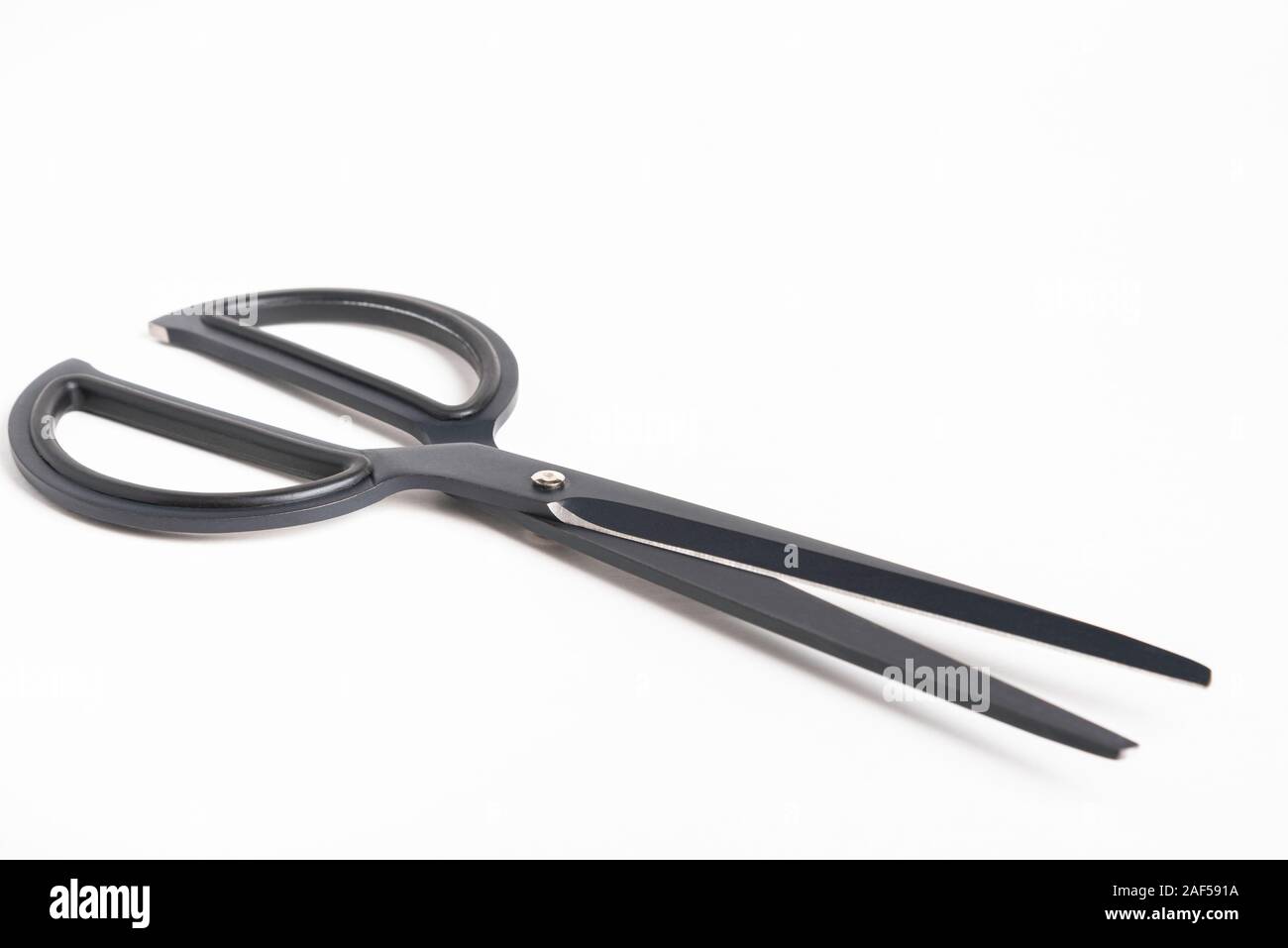 A pair of uniquely designed retro or vintage style scissors in black ...