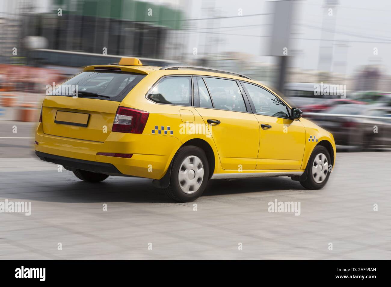 Yellow Taxi Moves On The City Street Stock Photo Alamy