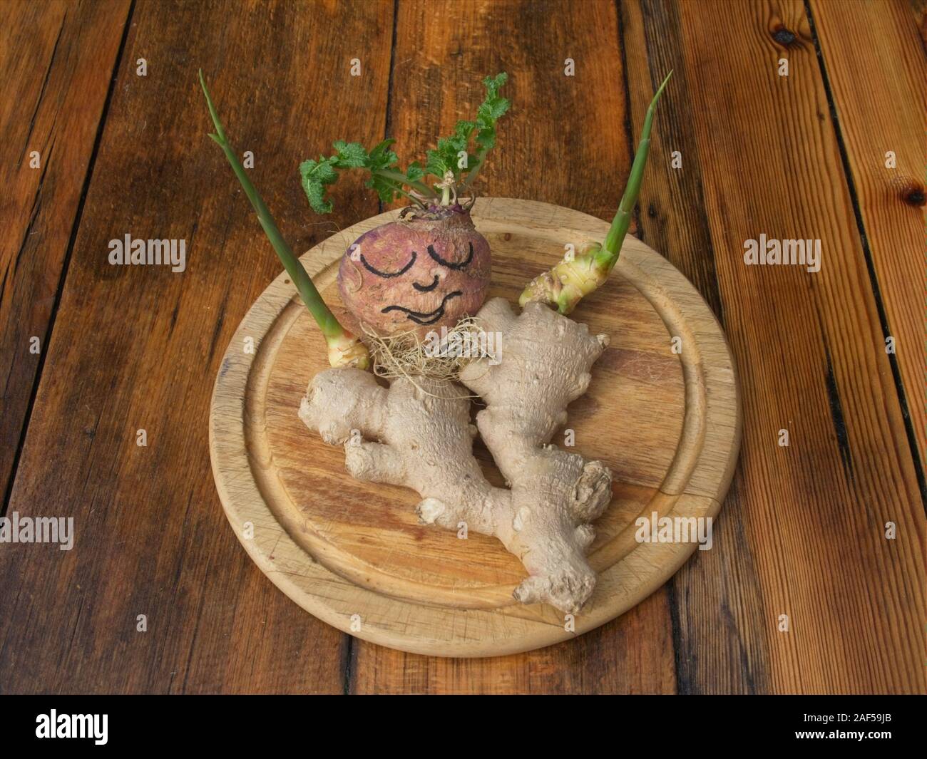 Arrangement with ginger and beet root on a table top Stock Photo - Alamy