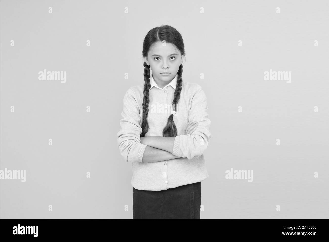 Schoolgirl calm serious pupil long hair. Beginning of academic year ...