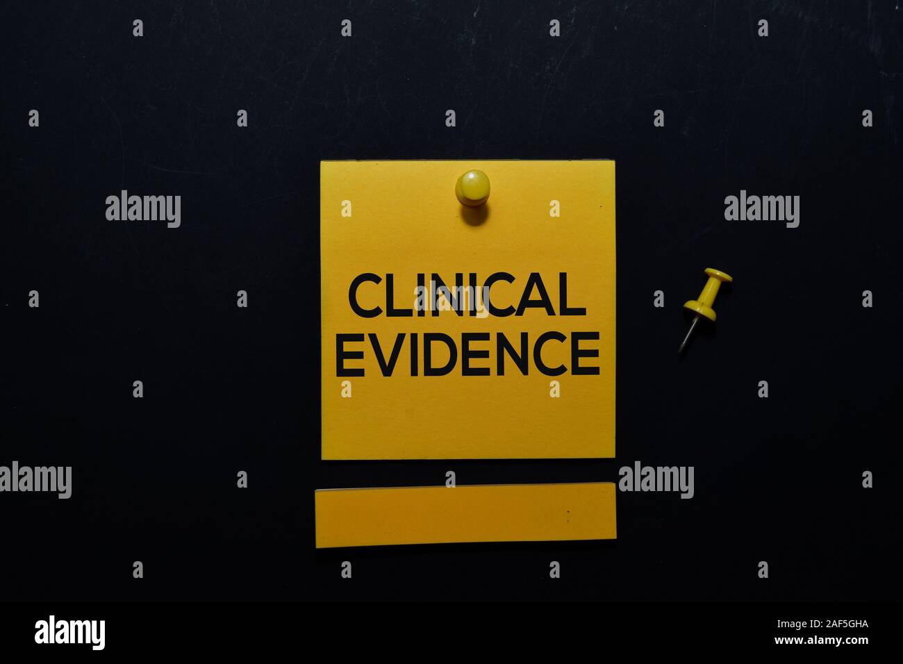 Clinical Evidence write on sticky notes isolated on office desk ...
