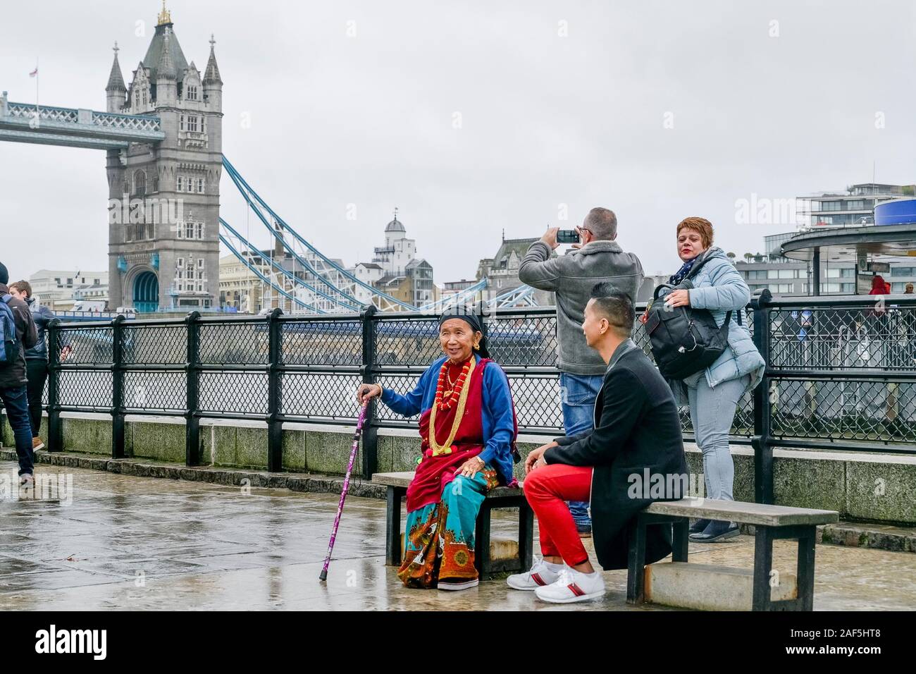 Tourists near Tower Bridge, London, England, UK Stock Photo - Alamy