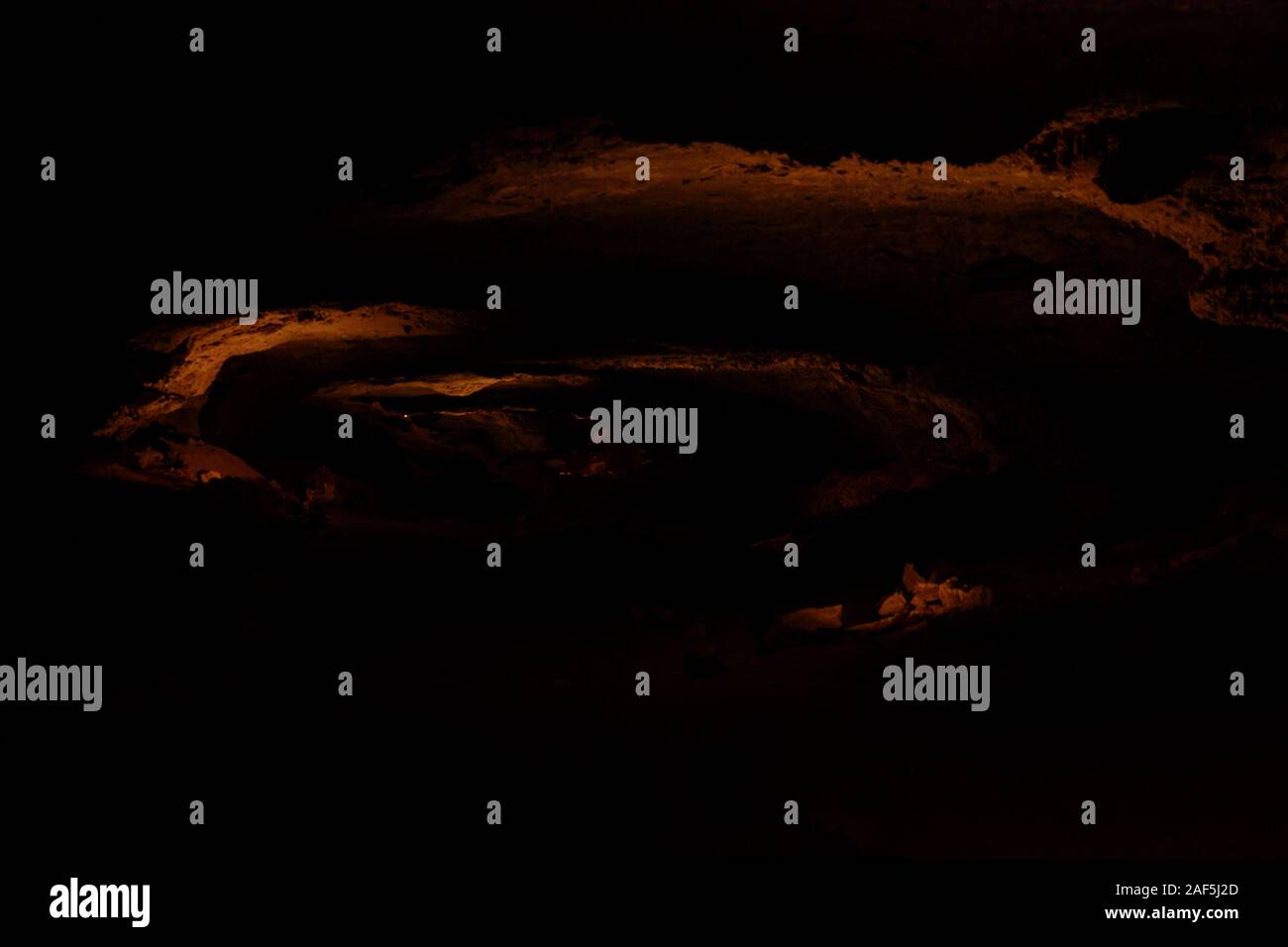 Dimly lit cave hi-res stock photography and images - Alamy