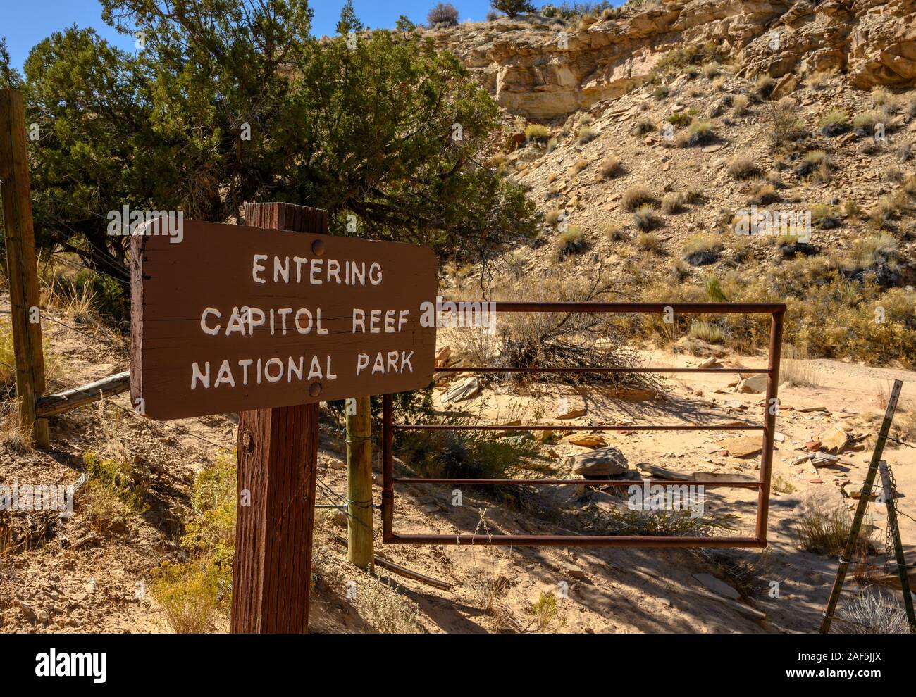 Entering Capitol Reef Sign and Gate at park boundary Stock Photo - Alamy