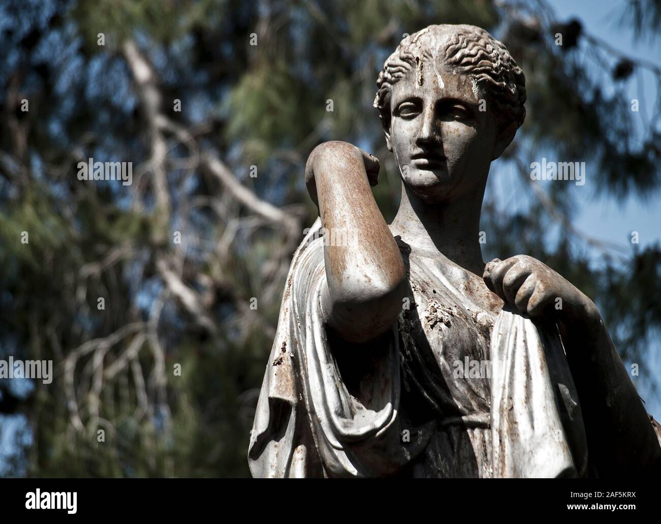 An antique Roman statue depicting some form of deity Stock Photo - Alamy