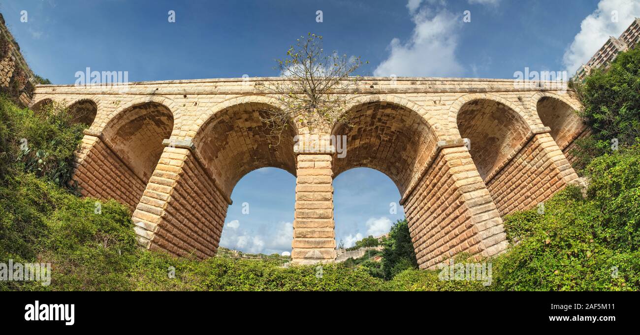 The Madliena Bridge in Malta, as seen from the bramble infested valley ...